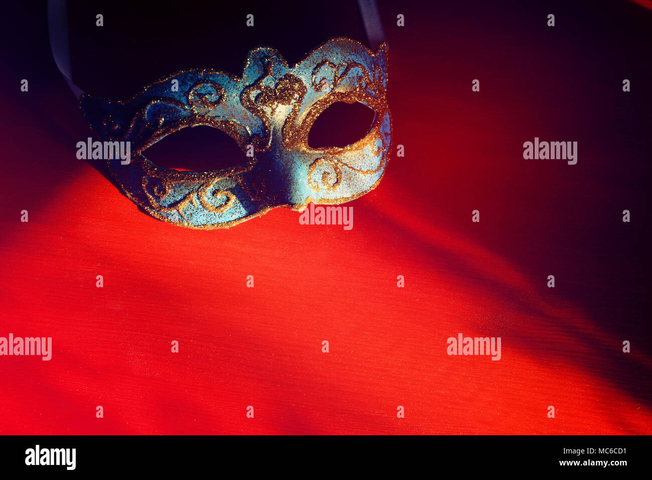 Image of elegant blue and gold venetian mask over red background Stock ...