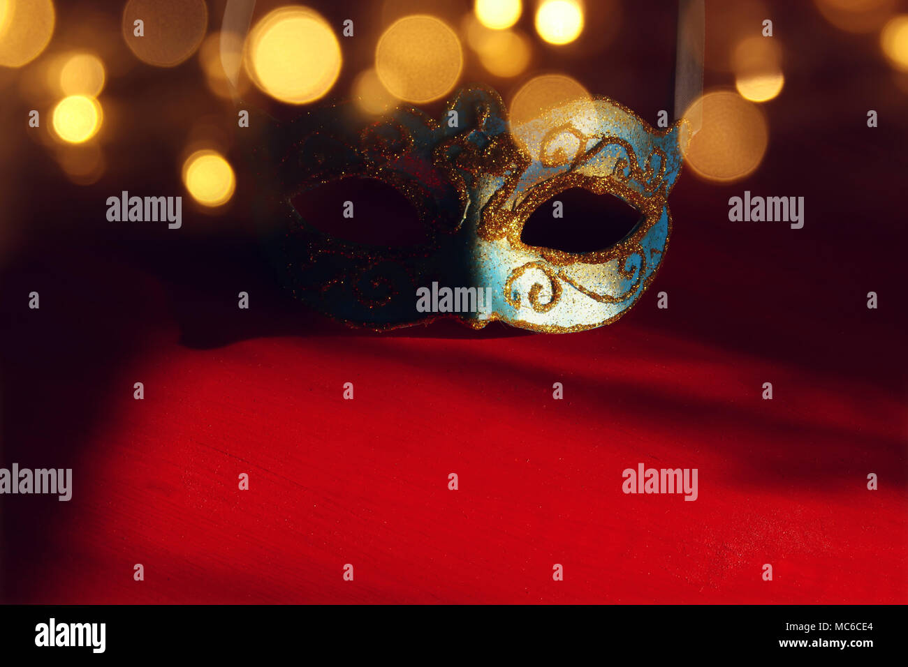 Image of elegant blue and gold venetian mask over red background Stock ...