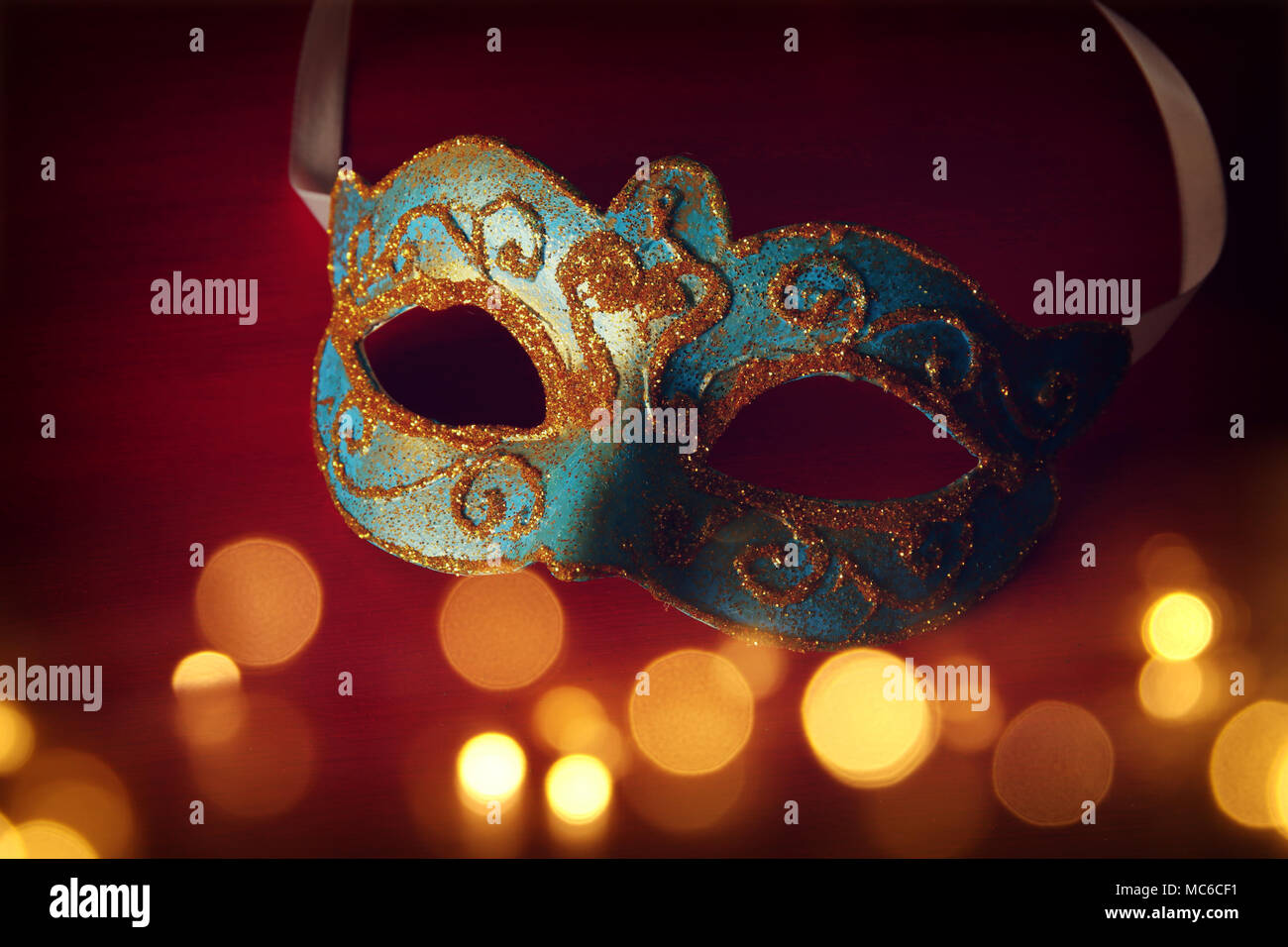 Image of elegant blue and gold venetian mask over red background Stock ...