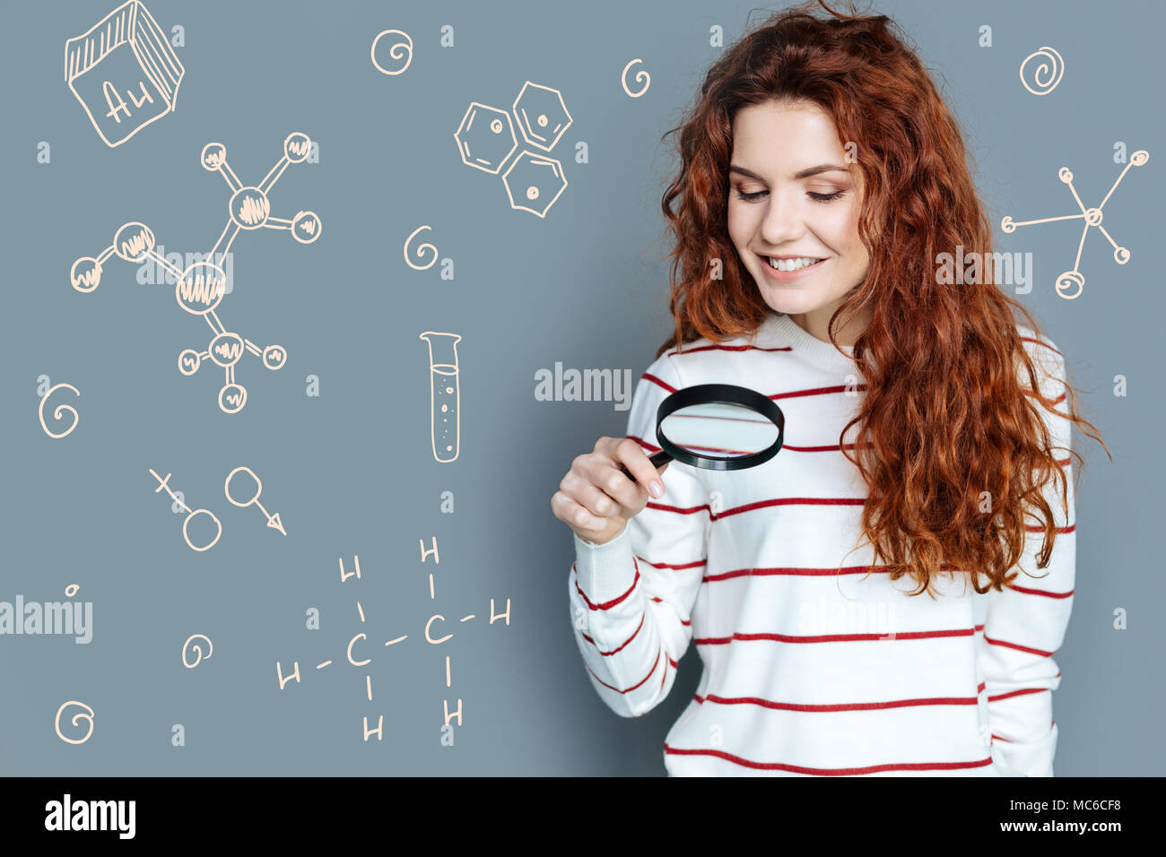Positive student smiling while being at the chemistry lesson Stock ...