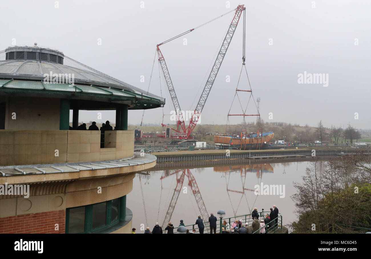 A full scale replica of HM Bark Endeavour being lifted past the Tees ...