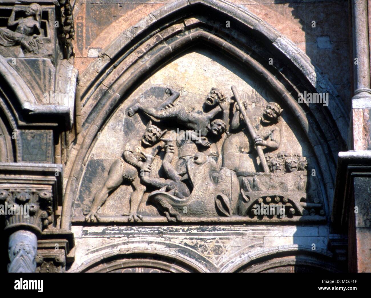 HELL - Demons throwing the damned into the mouth of Hell. Mediaeval bas ...