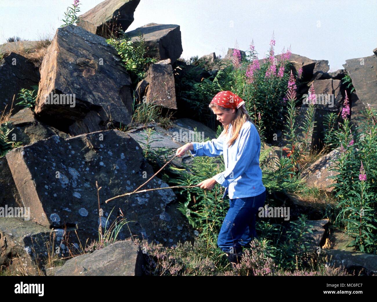 DOWSING Girl dowsing on the edge of Dimples Quarry, Haworth Moors ...