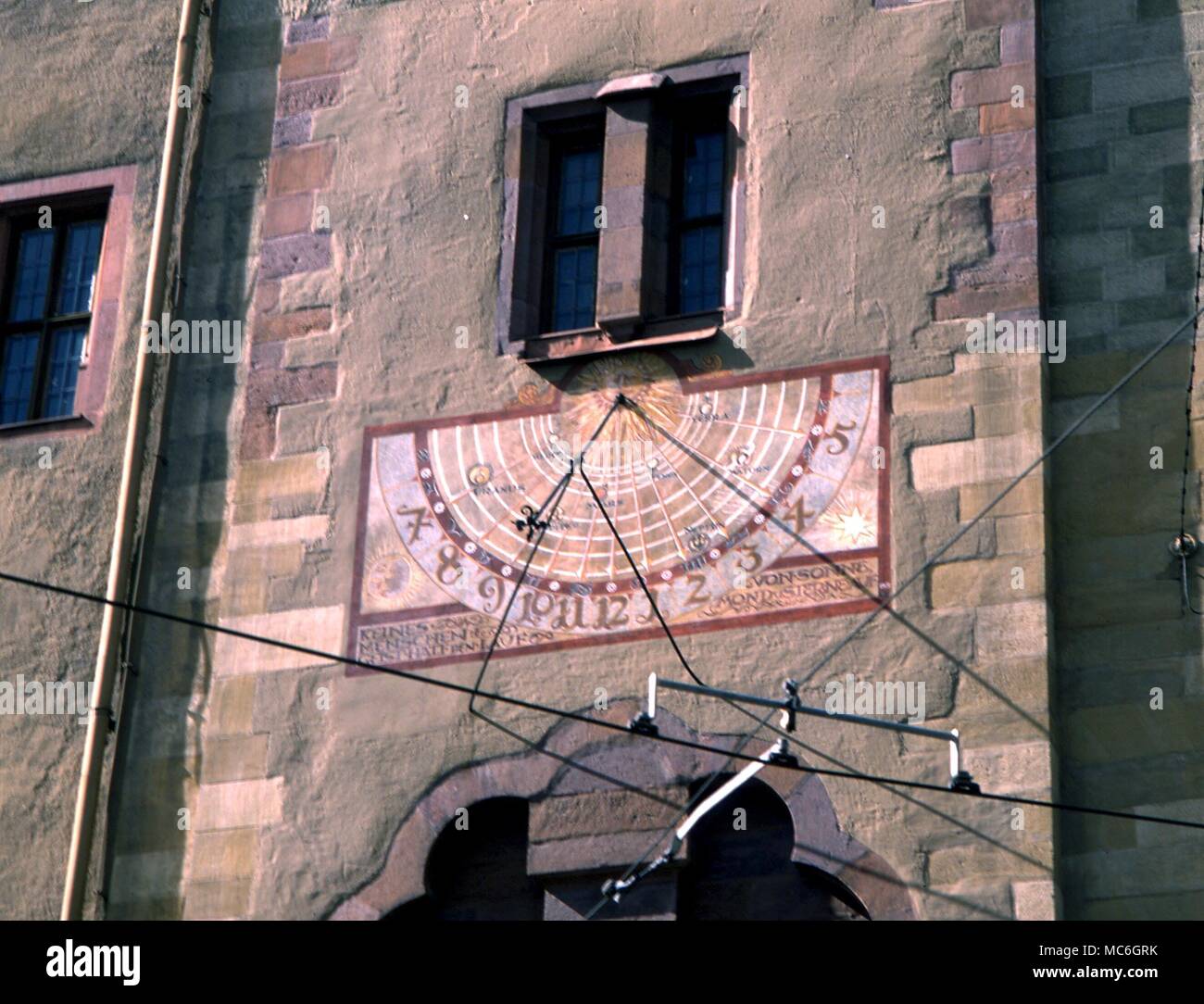 ASTROLOGY - SUNDIALS. The 15th century painted sundial on the facade of ...