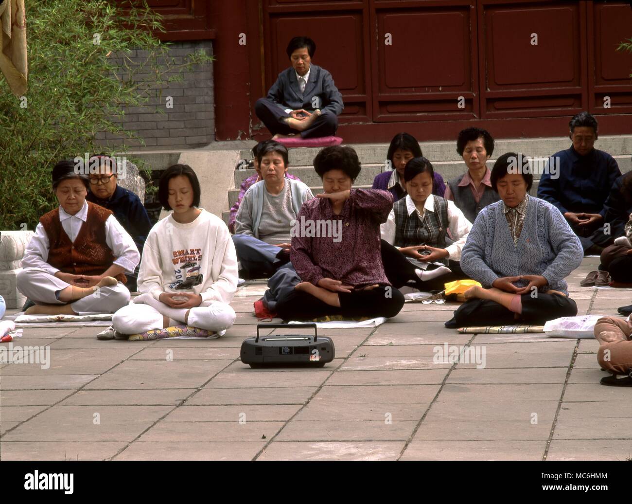 Meditation group outside a temple in Beijing, China Stock Photo - Alamy
