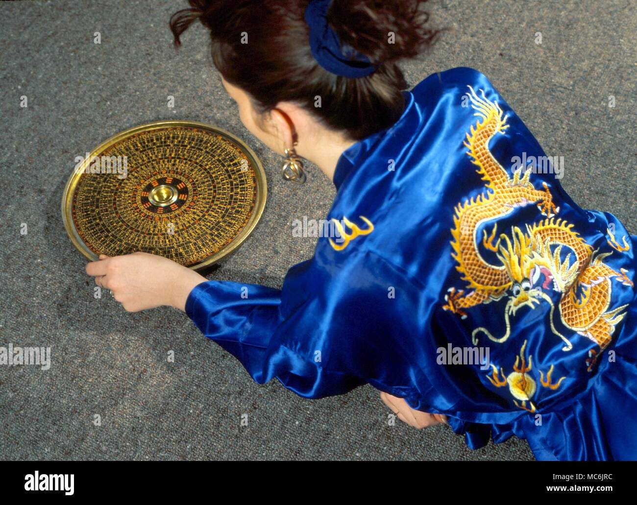 FENG SHUI - CHINESE 'GEOMANCY'. Girl with a Lo King disk, or geomancer ...