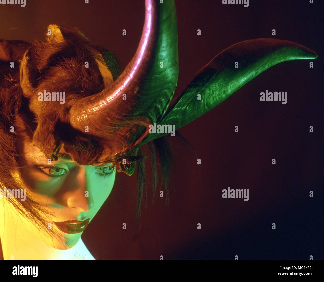 Black Magic Female manniken wearing a pair of goat horns, which were ...