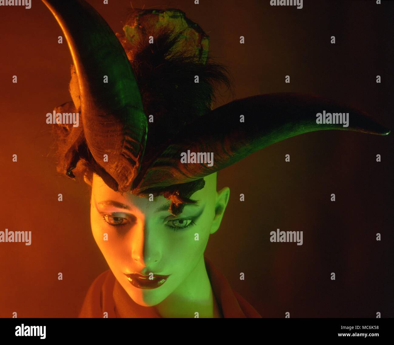 Black Magic Female manniken wearing a pair of goat horns, which were ...