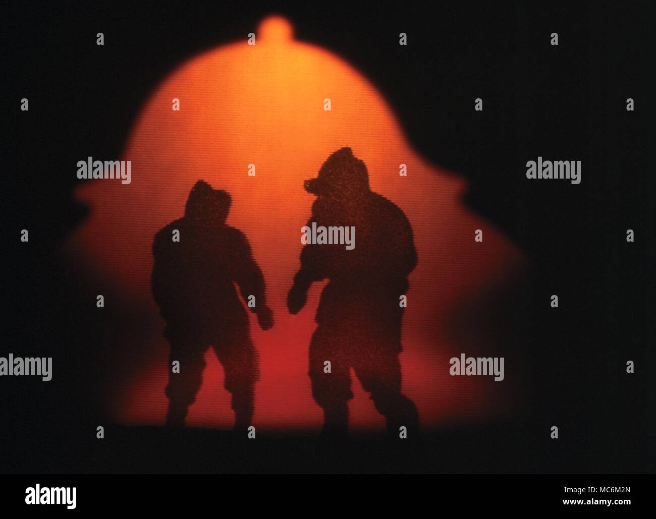 UFOs. Two figures of "Aliens"" against an alien spacecraft which glows ...