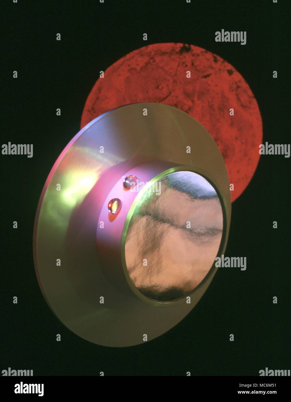 UFOs. Display model of a Ufo against a planet Stock Photo - Alamy