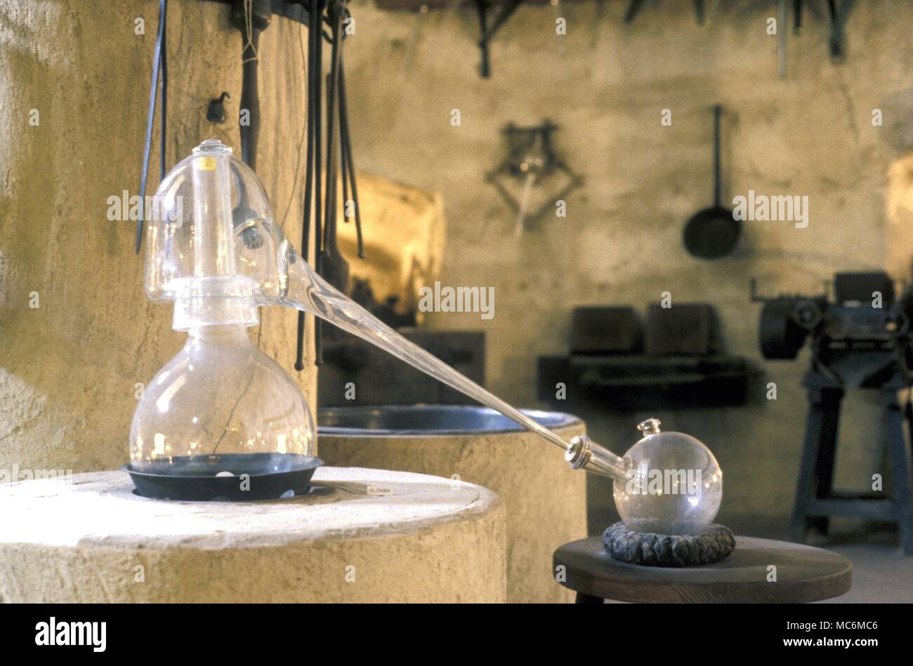 ALCHEMY - ALCHEMICAL DISTILLATION. Retorts with burner in the small ...