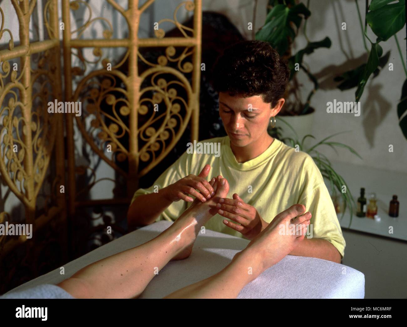 Massage - Polarity therapy. Massaging a patient's foot Stock Photo - Alamy