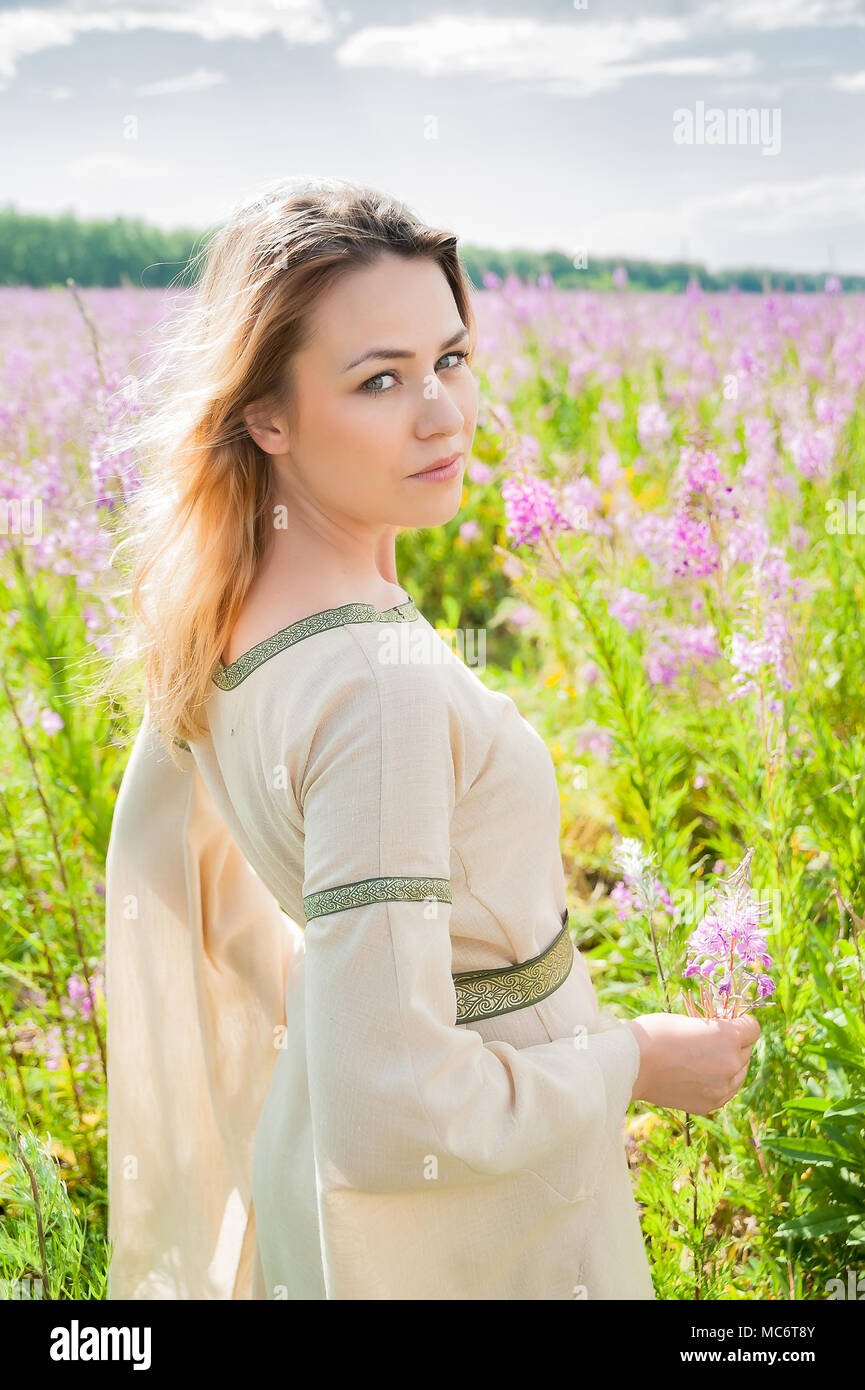 Pretty sad girl on meadow Stock Photo - Alamy
