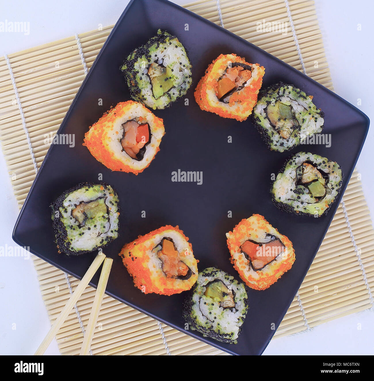 different types of Maki sushi on a black plate Stock Photo - Alamy