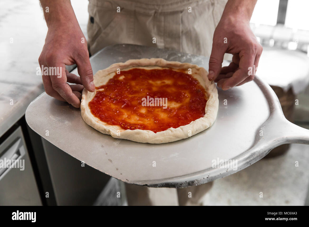 Fresh original Italian raw pizza, preparation in traditional style ...