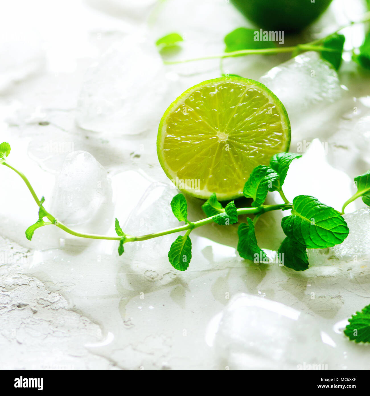Homemade lime lemonade with cucumber, rosemary and ice, white ...