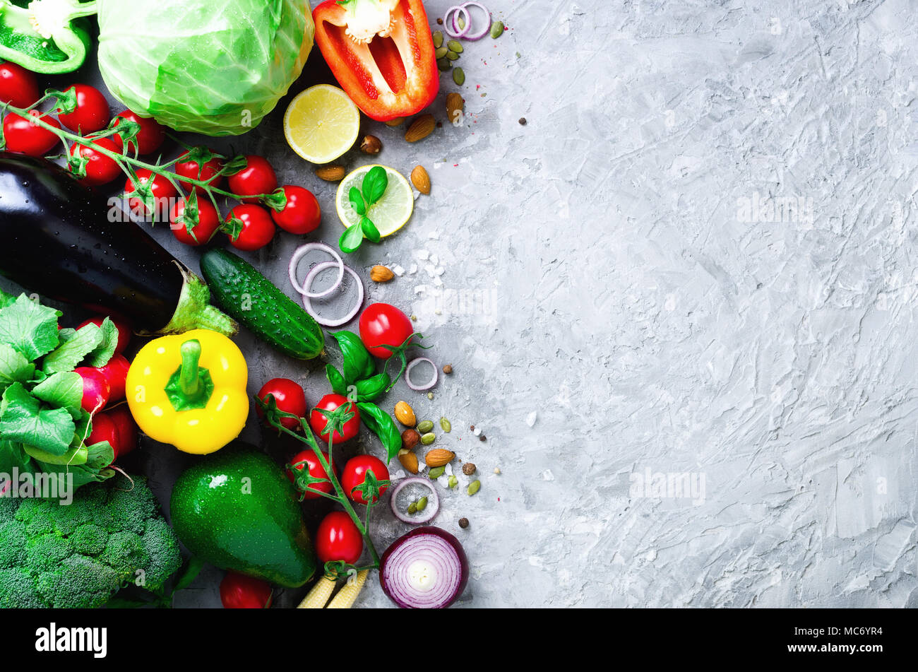 Set of fresh vegetables on grey background. Aromatic herbs, onion ...
