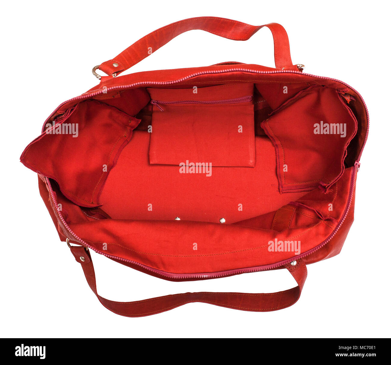 top view of open empty red travelling bag isolated on white background ...