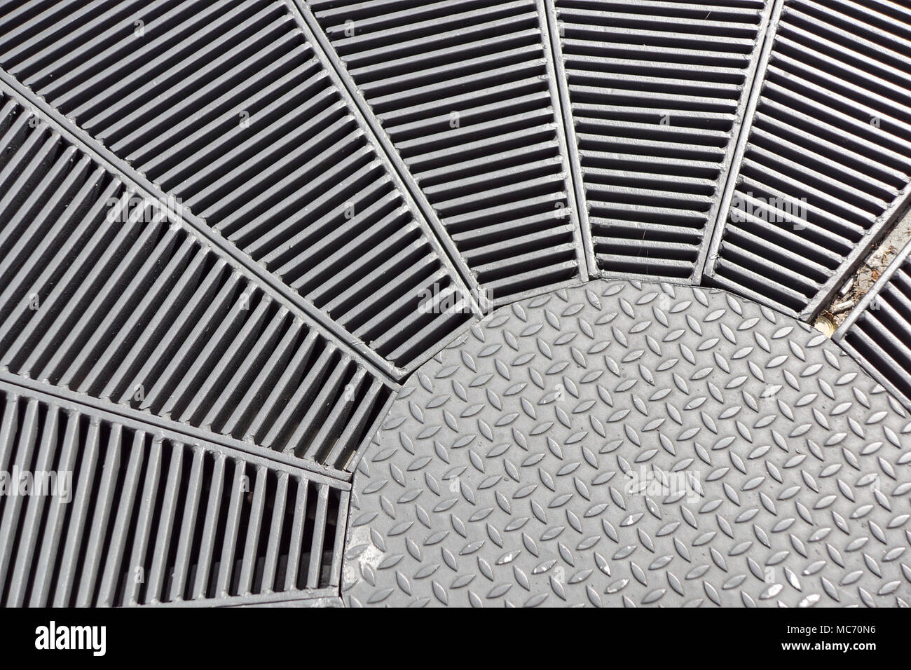 silver round metal manhole cover on the floor. close up Stock Photo - Alamy