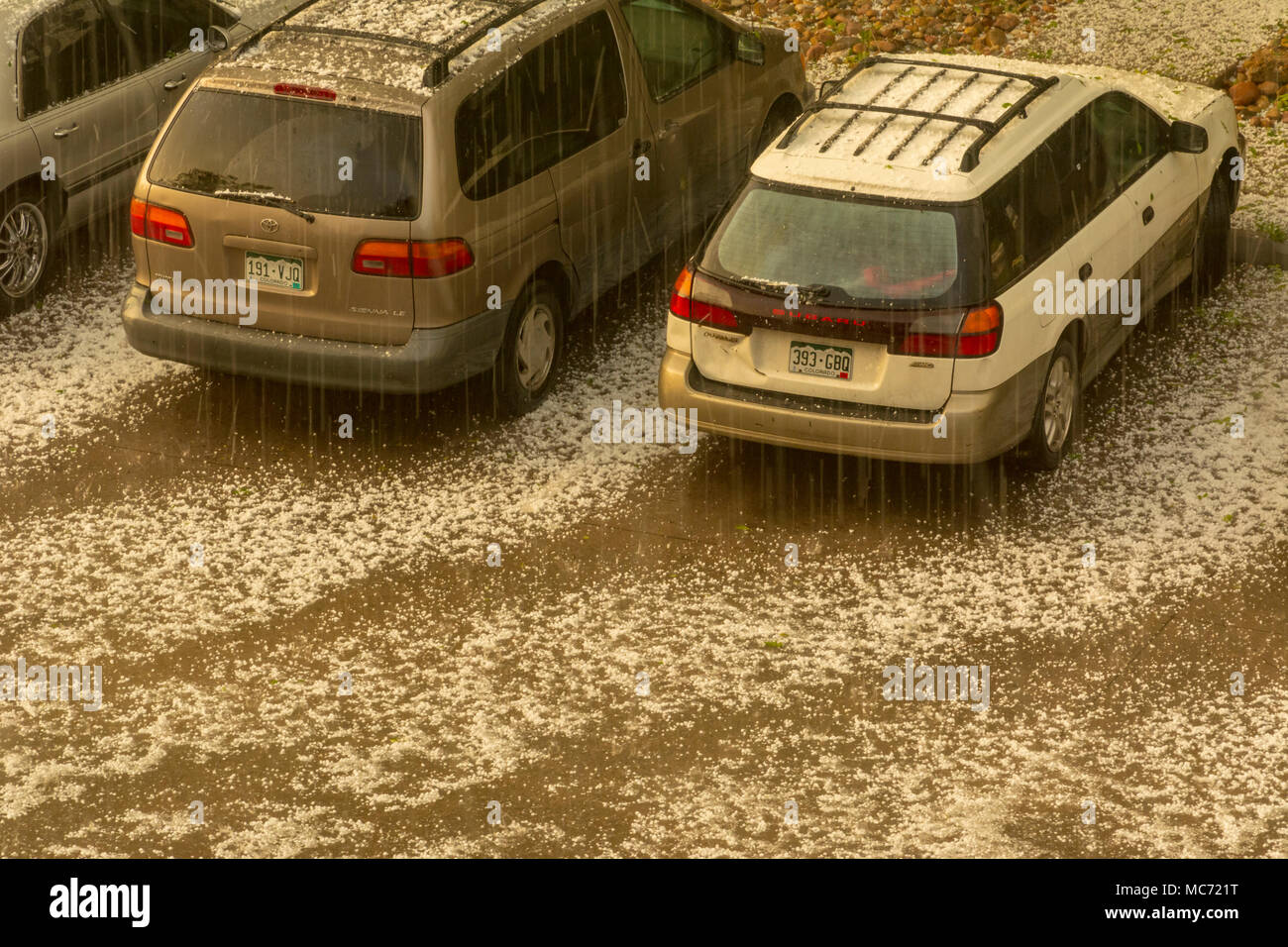 Hail storm. Hail falling on cars and parking area in Aurora Colorado US ...