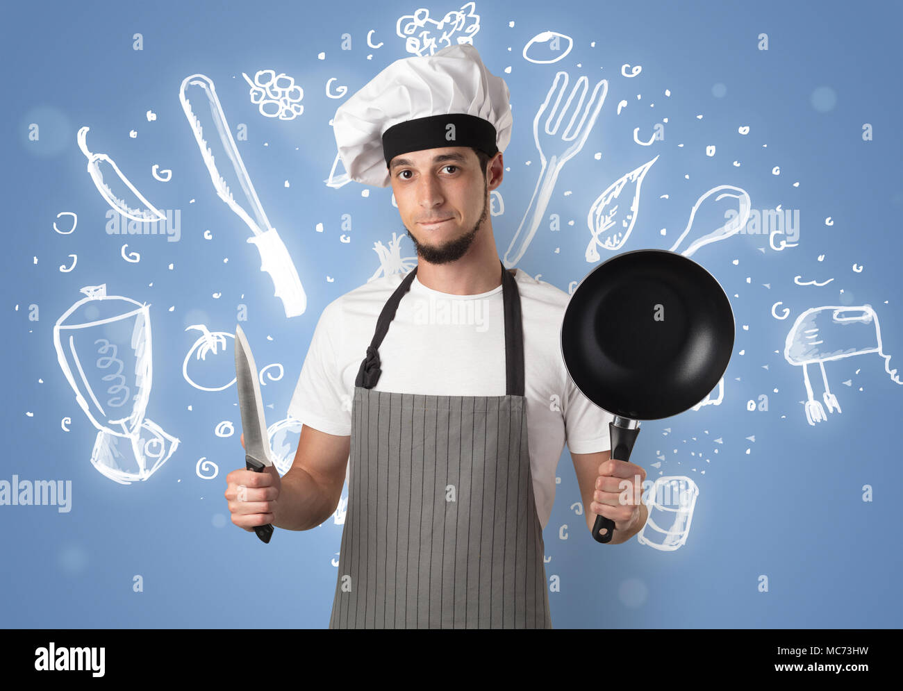 Young cook with kitchen instruments and drawn recipe concept on ...