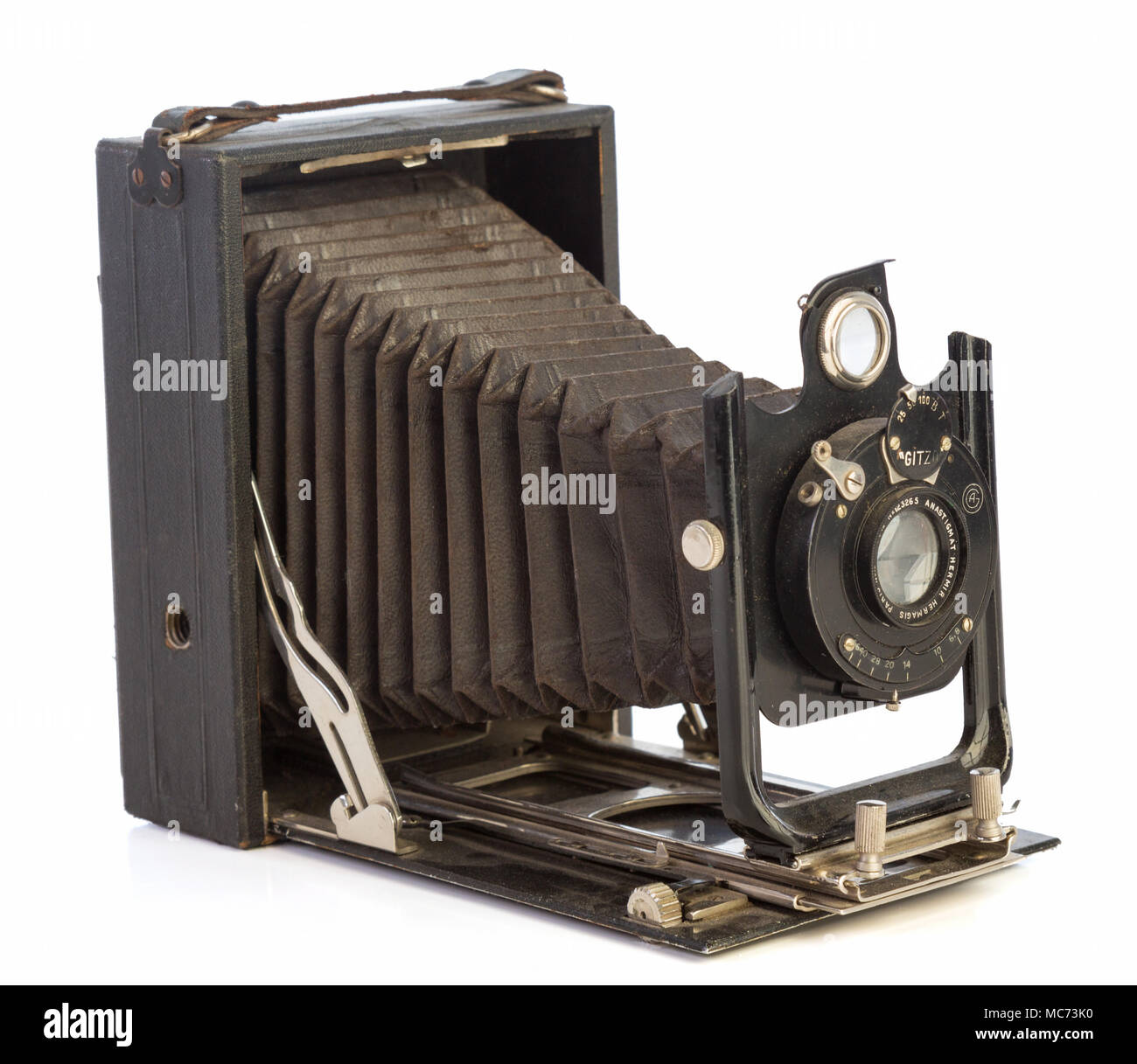Old black camera with bellows on a white background Stock Photo - Alamy