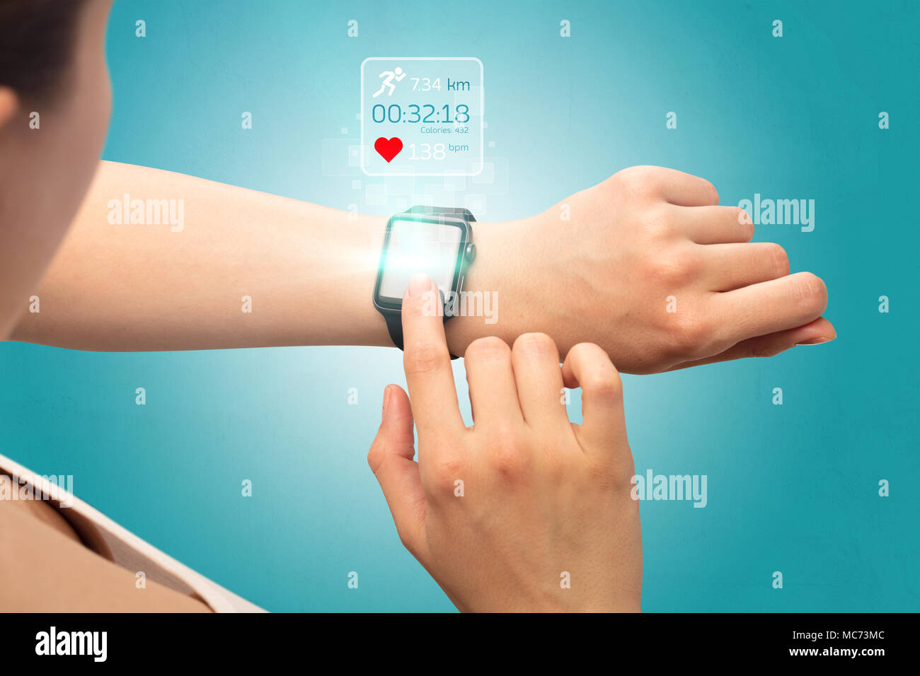 Female hand with smartwatch and running concept above Stock Photo - Alamy