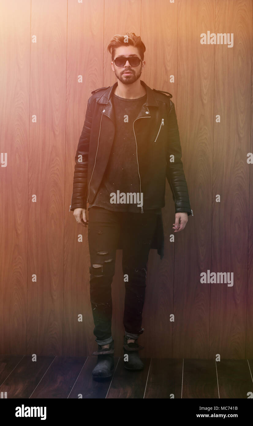 full body picture of a casual man in leather jacket, jeans and boots ...