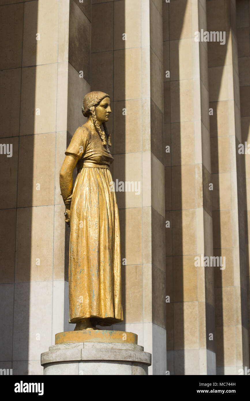 horizontal side view closeup of classical woman statue with tall white ...