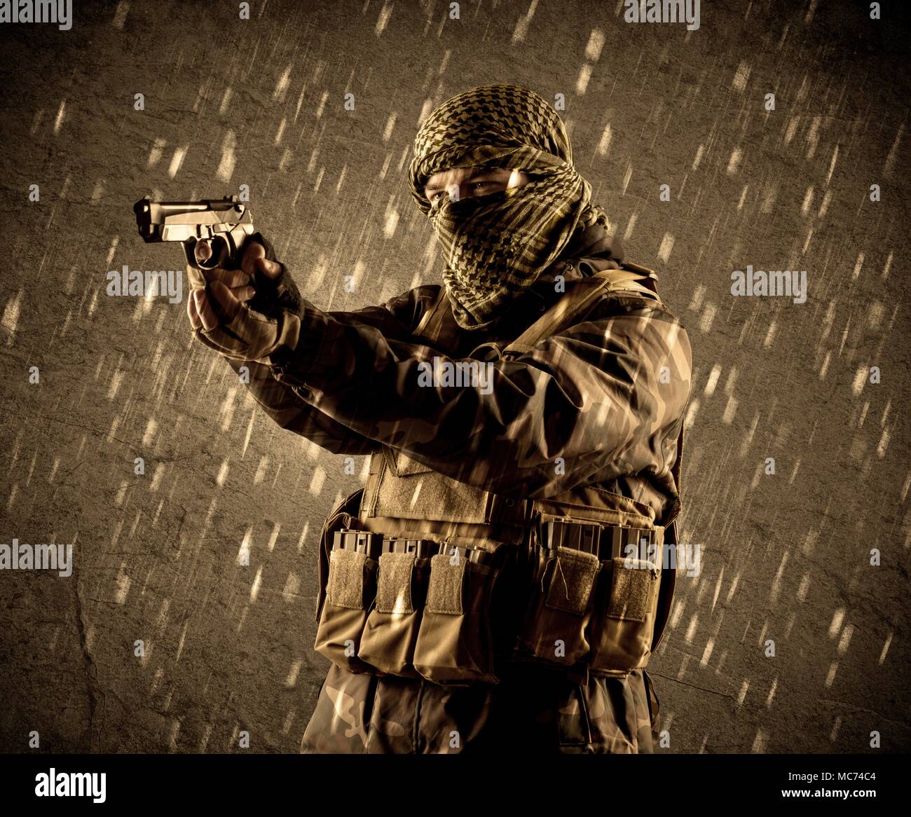 Portrait of dangerous heavily armed terrorist soldier with mask on ...