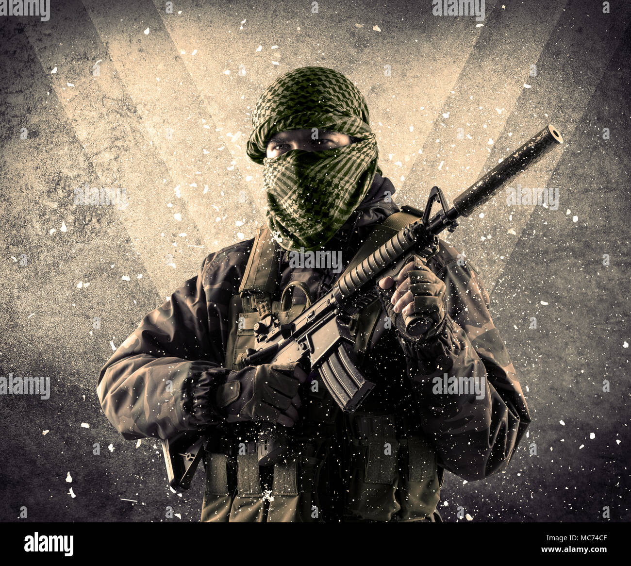 Portrait of a dangerous masked armed soldier with grungy light ...