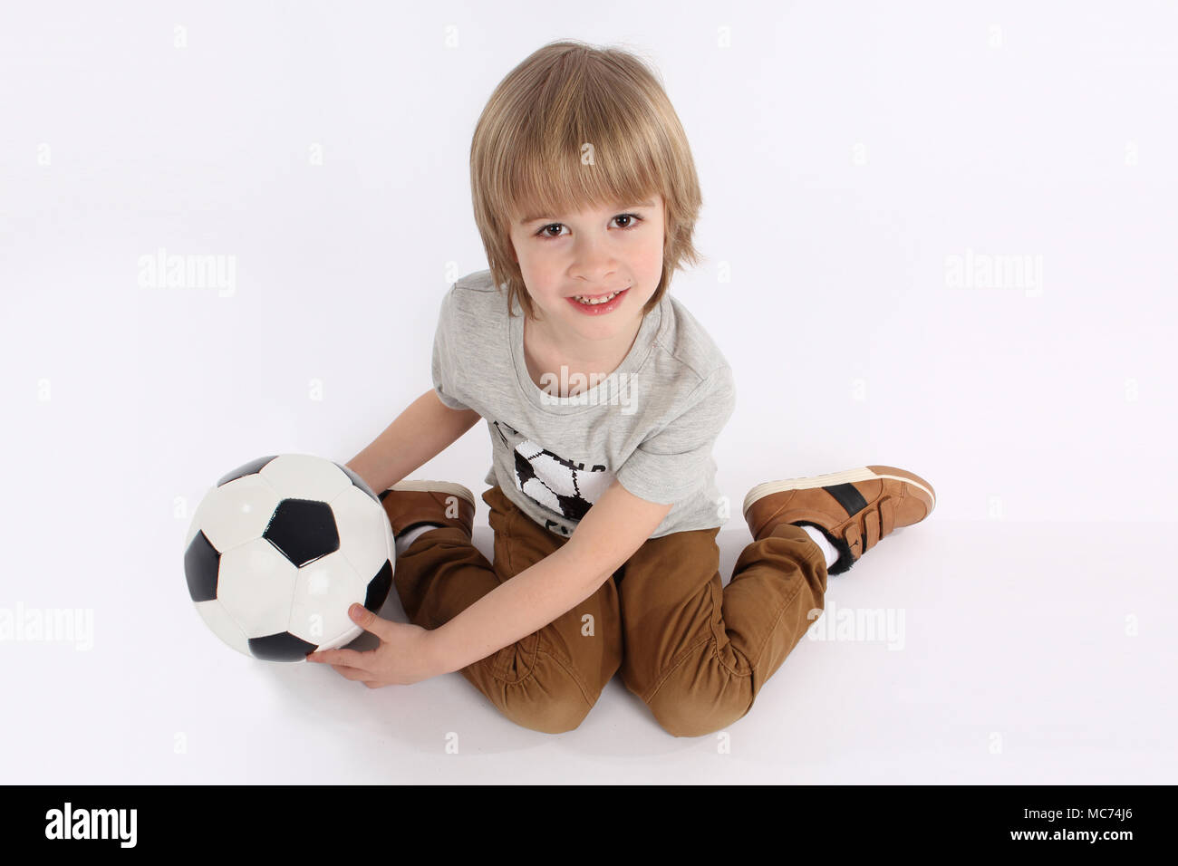 Soccer player football boy Stock Photo - Alamy