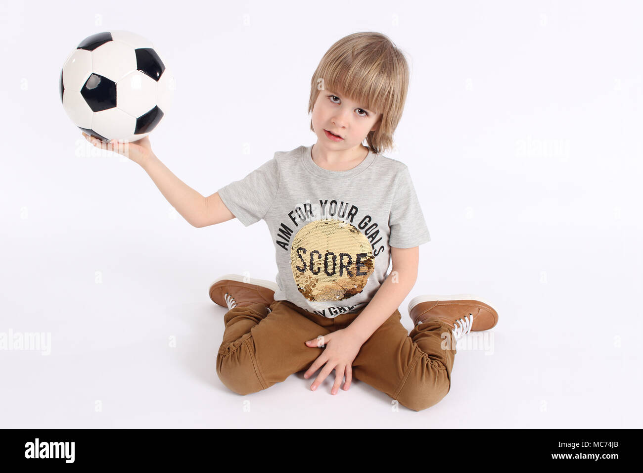 Soccer player football boy Stock Photo - Alamy