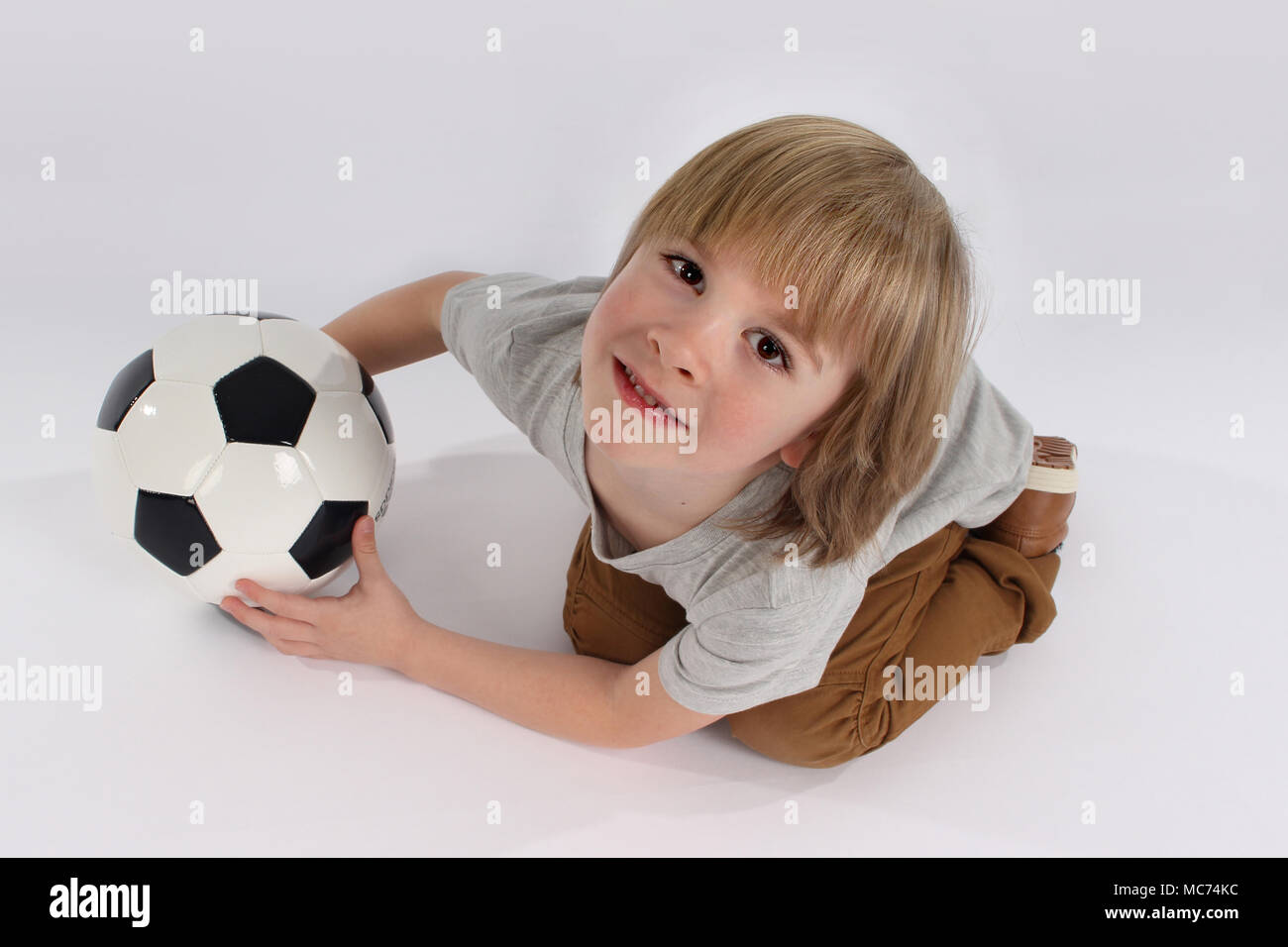 Soccer player football boy Stock Photo - Alamy