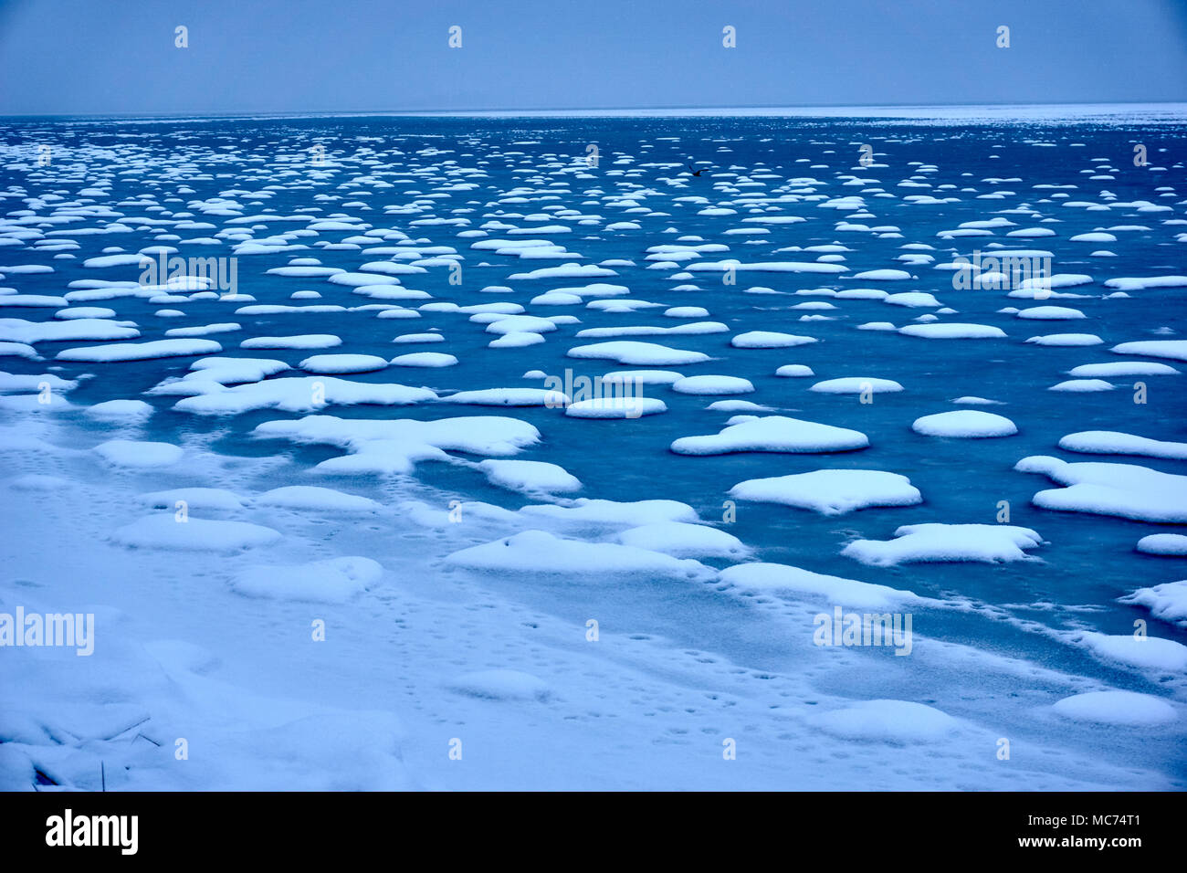 The frozen sea is beautiful clouds at sunset. Denmark. Baltic Sea ...