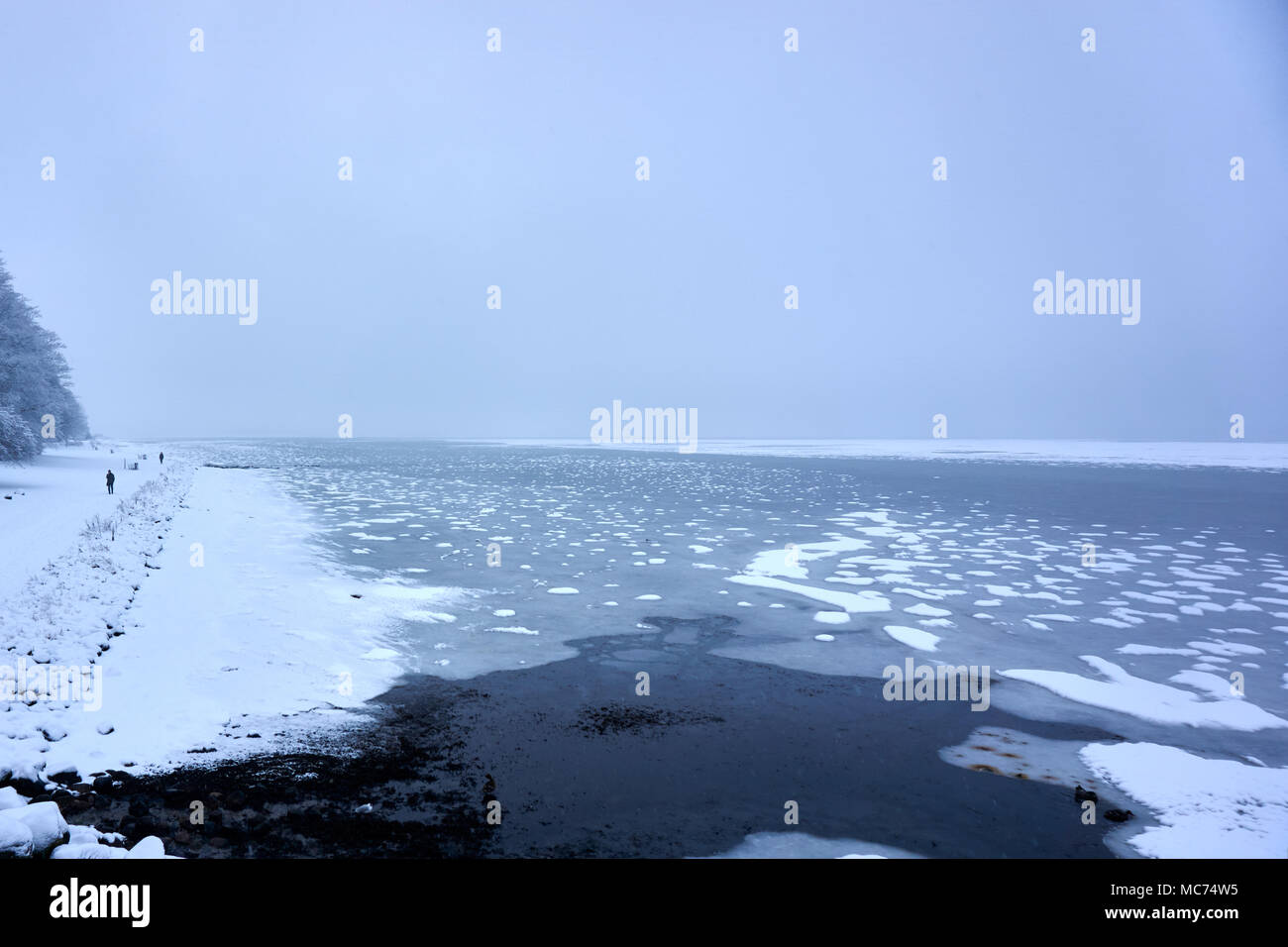 The frozen sea is beautiful clouds at sunset. Denmark. Baltic Sea ...