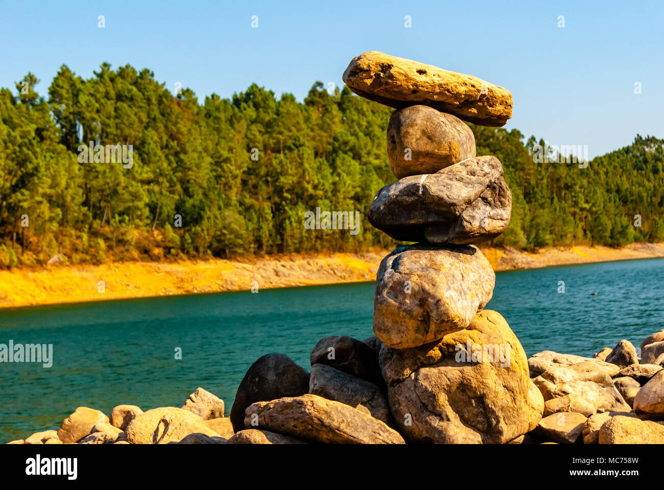 Stone pyramid on a floating river Stock Photo - Alamy