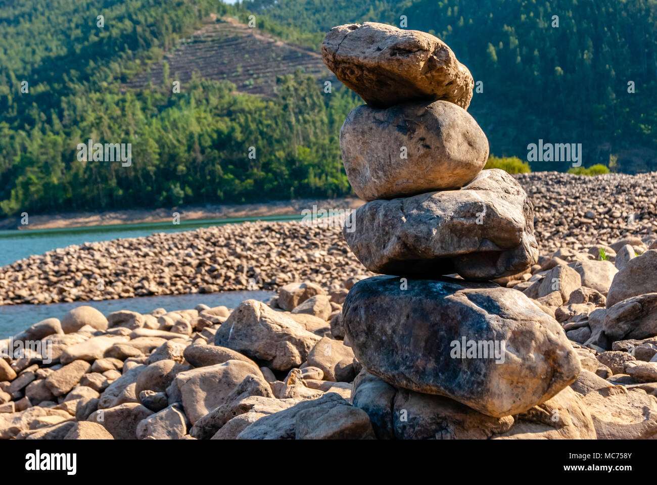 Stone pyramid on a floating river Stock Photo - Alamy