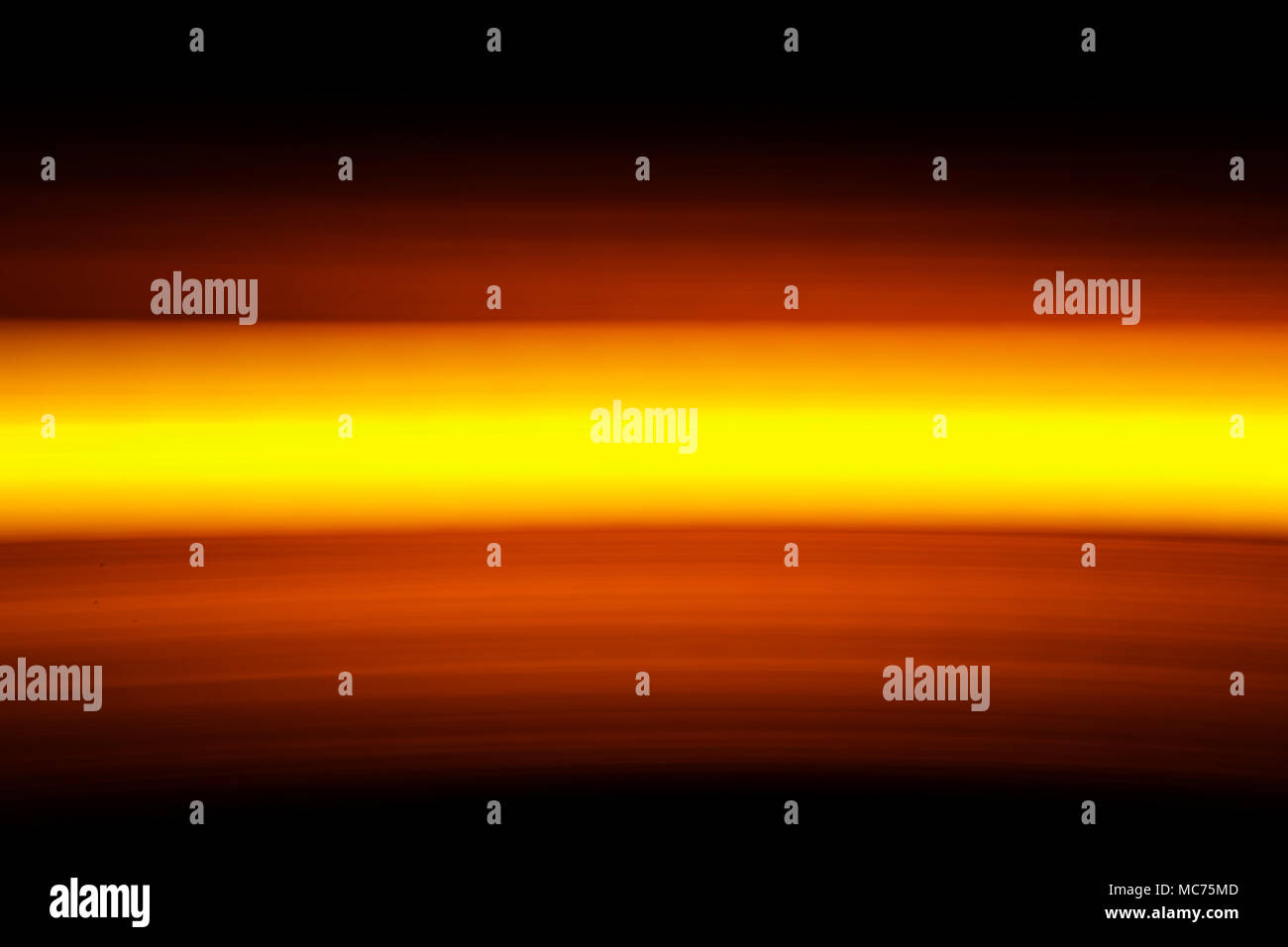 Abstract luminous orange background in the dark Stock Photo - Alamy