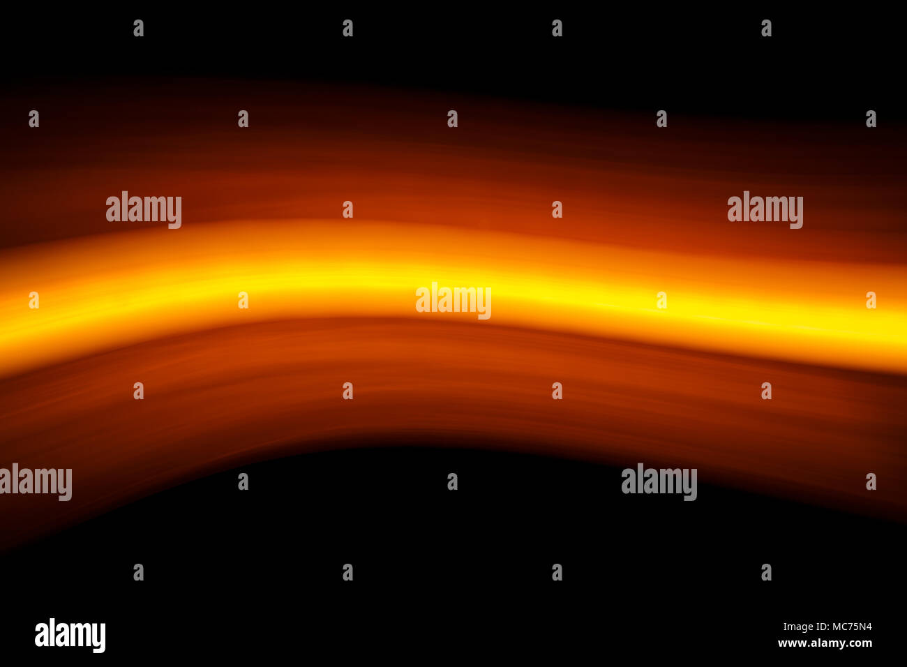 Abstract luminous orange background in the dark Stock Photo - Alamy