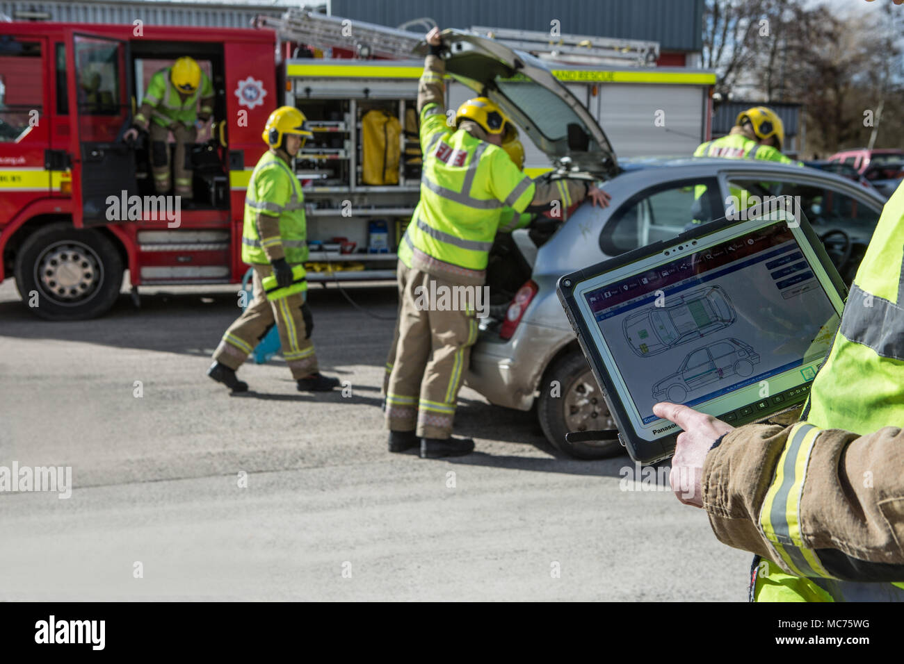 Male Firefighter using tech at work Stock Photo - Alamy