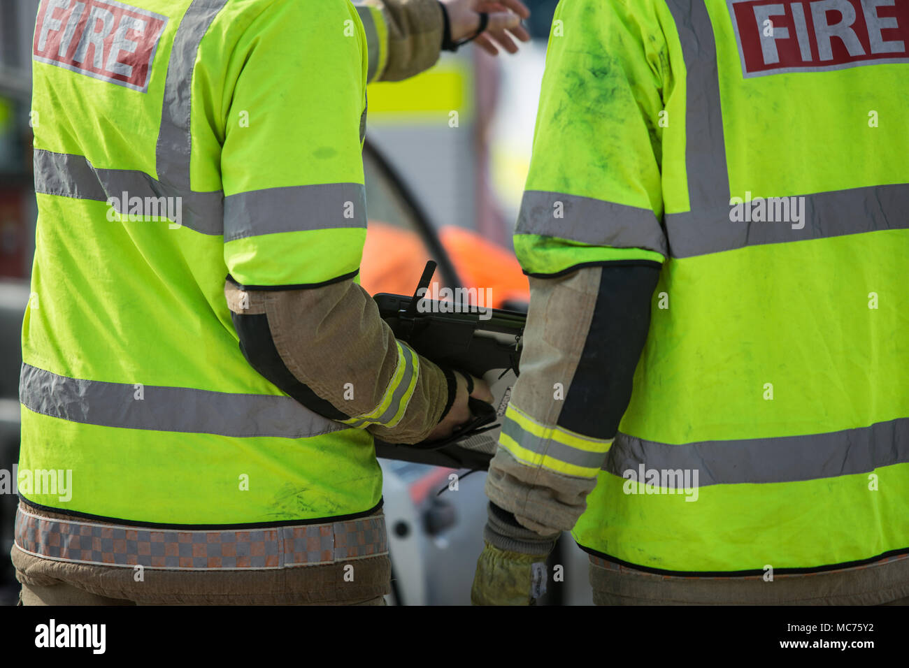 Group of firemen on rescue job using handheld tablet at work Stock ...