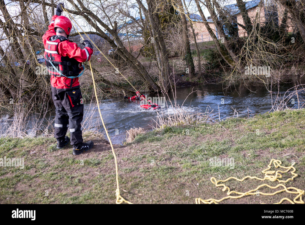 Fire fighters during a river rescue operation pulling someone from ...