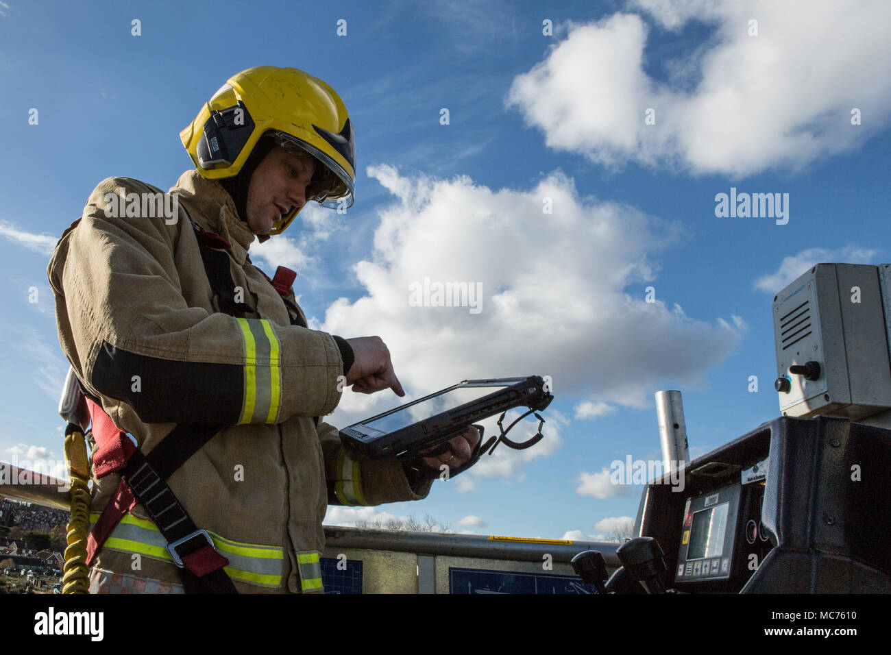 Male Firefighter using tech at work Stock Photo - Alamy