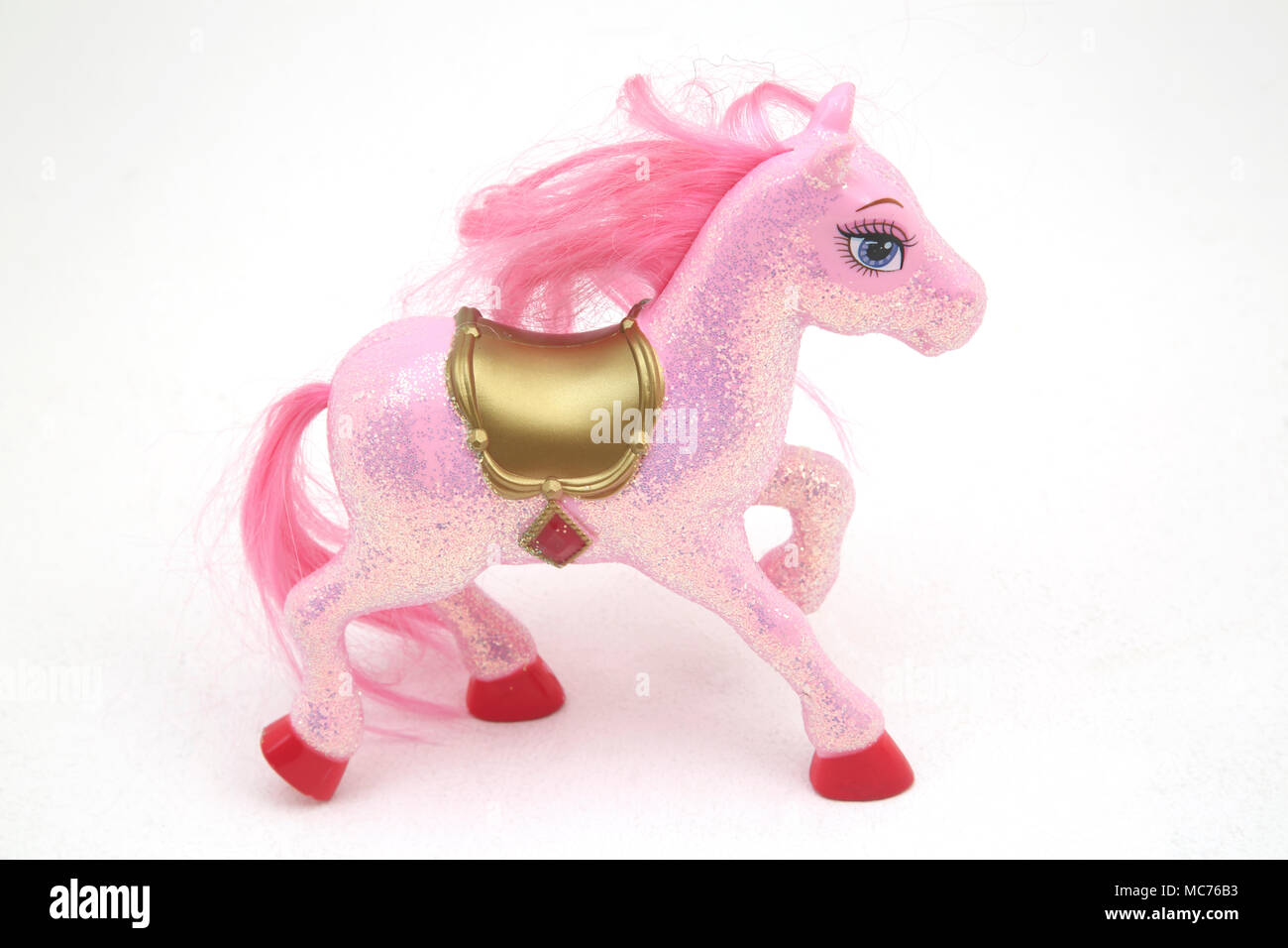 Pink Glitter Horse / Pony Toy with Gold Saddle Stock Photo - Alamy