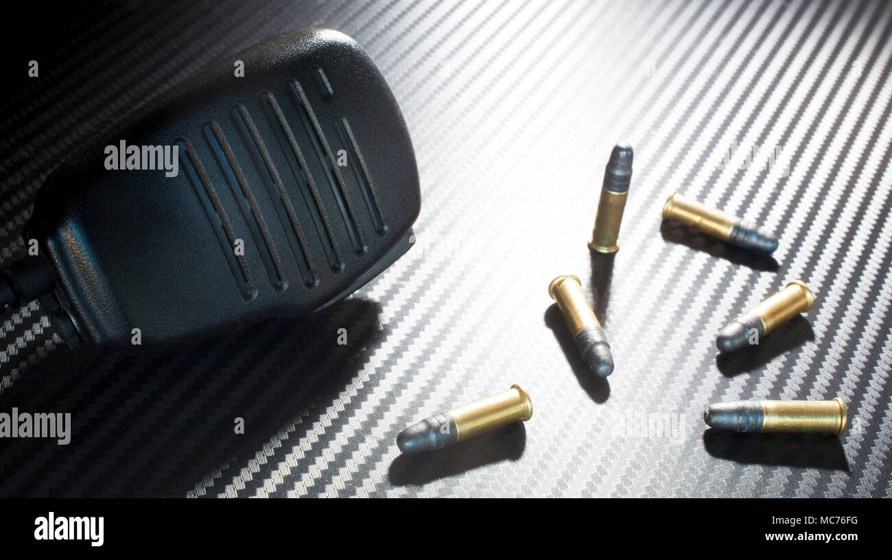Police radio microphone and rim fire cartridges Stock Photo - Alamy