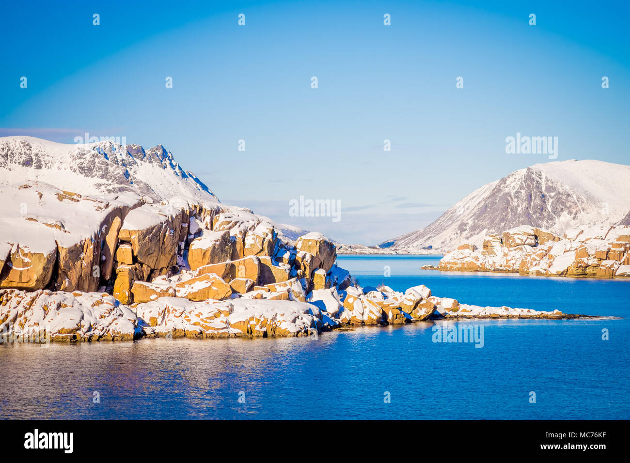 Outdoor view of snowy rock mountain covered during winter in the Arctic ...