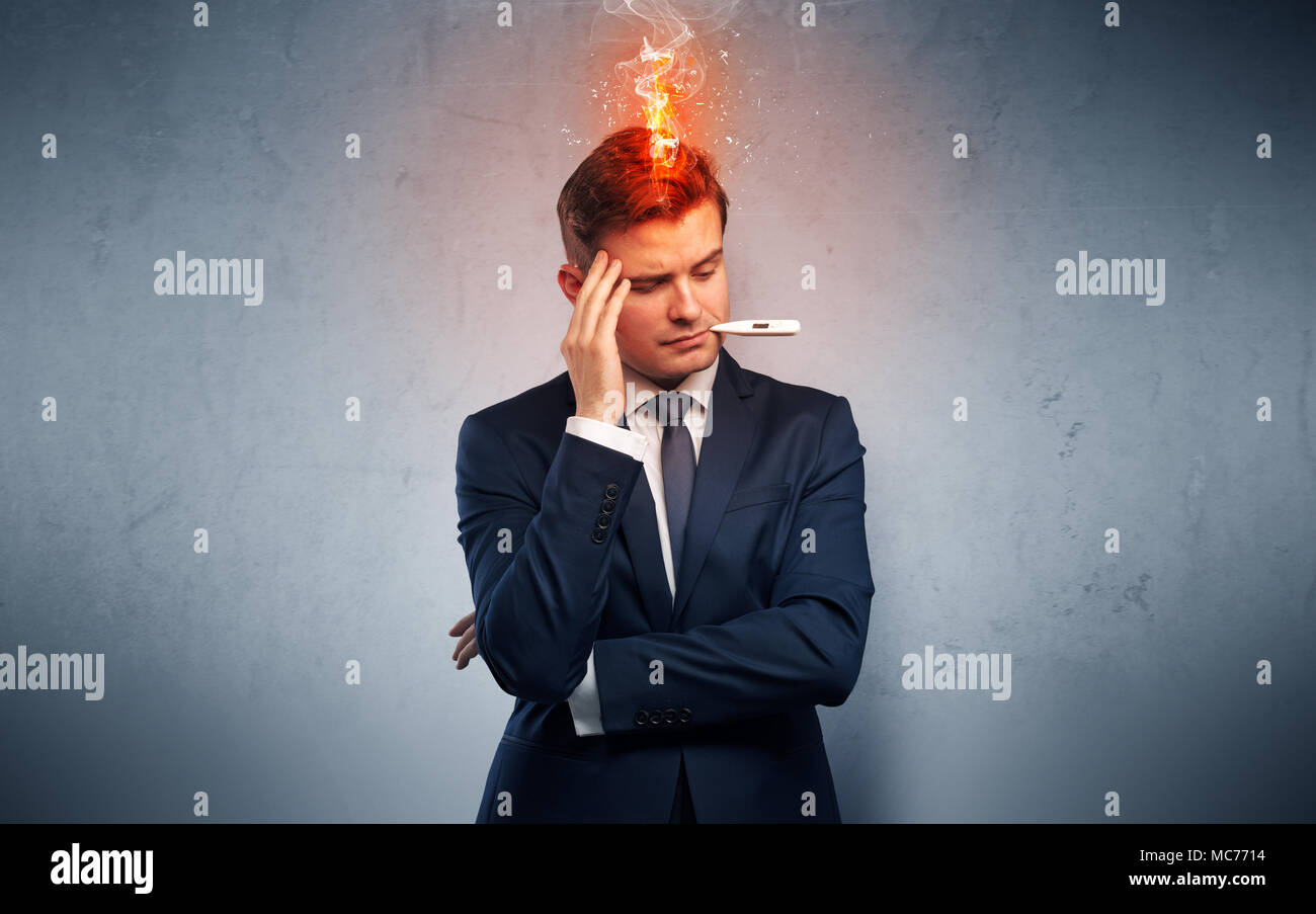 Fever businessman with burning head concept Stock Photo - Alamy
