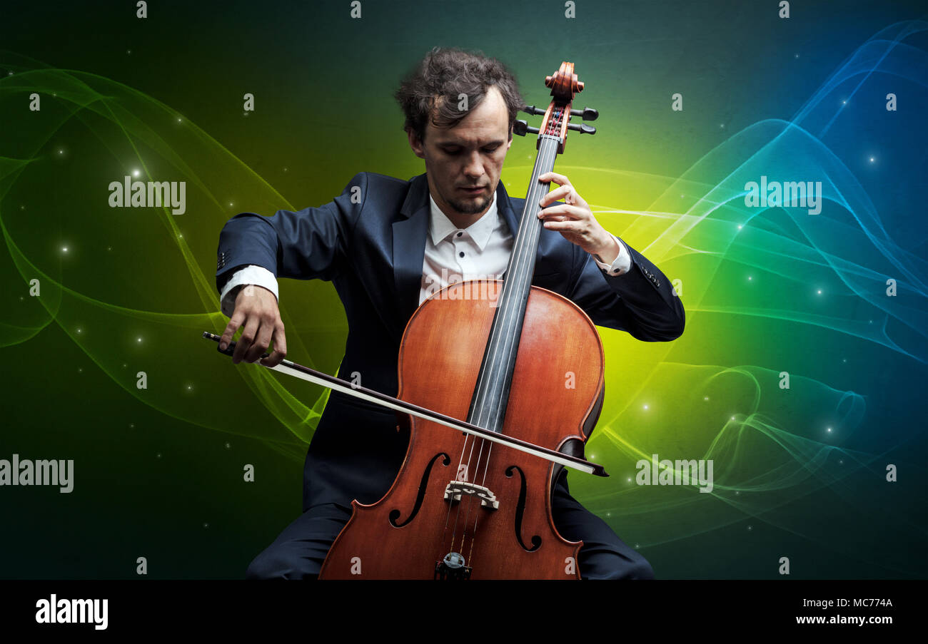 Serious classical cellist with fabled sparkling wallpaper Stock Photo ...