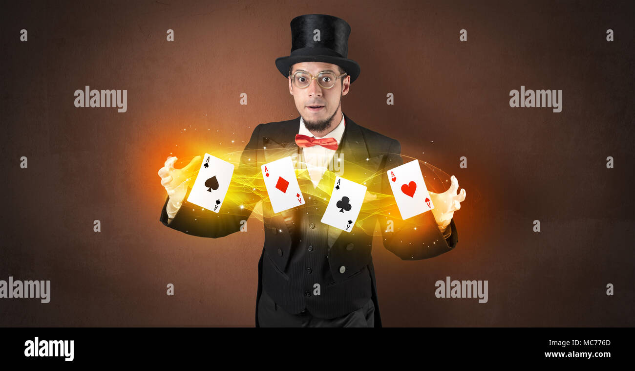 Illusionist in tails bandy play cards between his two hands Stock Photo ...